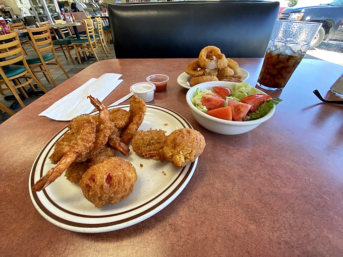 Jumbo shrimp&mdash;that delicious oxymoron&mdash;perfectly fried alongside a garden-fresh salad and golden onion rings. Balance in all things.