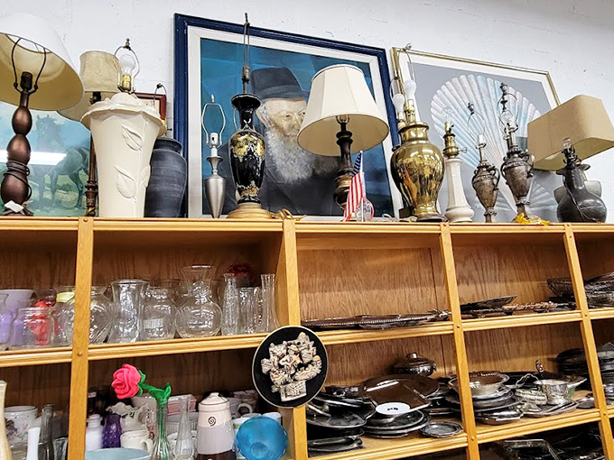 Lamps and artwork create a gallery of nostalgia where one person's outdated decor becomes another's ironic statement piece.