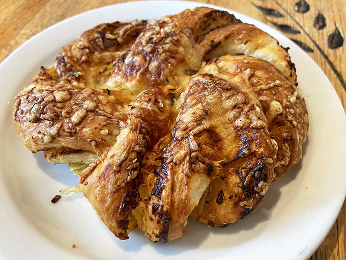 A croissant that's had an exciting life upgrade. Flaky, buttery layers cradle savory fillings in what can only be described as the breakfast equivalent of winning the lottery.