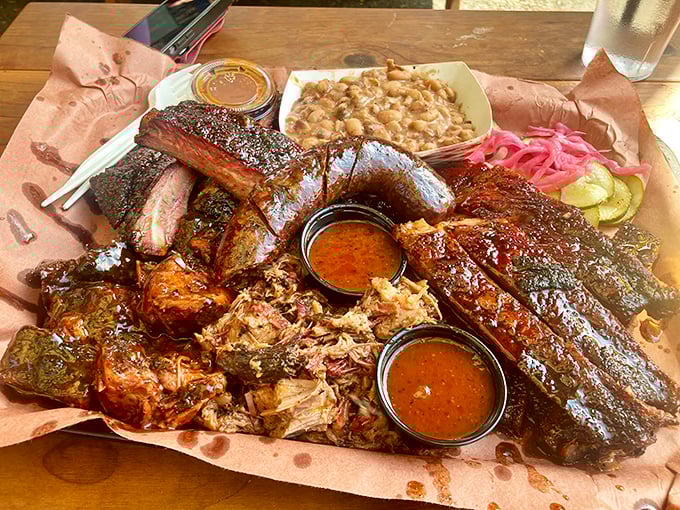The barbecue sampler that makes grown adults weep with joy. Ribs, brisket, sausage, and pulled pork create a meat symphony on butcher paper.