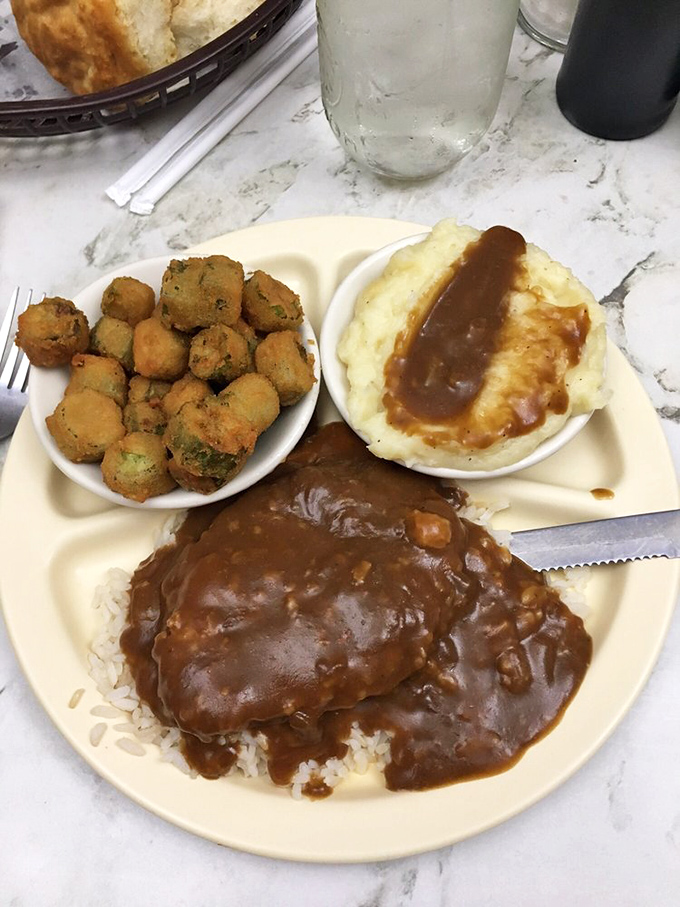 Country comfort on a plate&mdash;meatloaf swimming in rich gravy, alongside mashed potatoes and fried okra. This is edible North Carolina history.