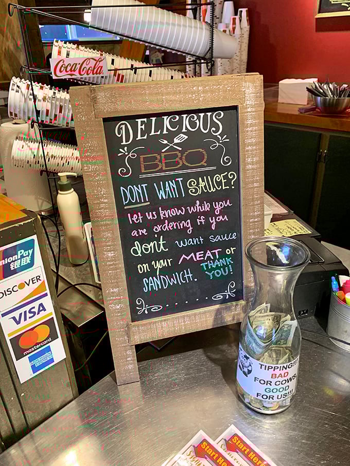 "Don't want sauce?" The audacity! This chalkboard politely challenges one of the fundamental assumptions of BBQ culture with utterly charming penmanship.
