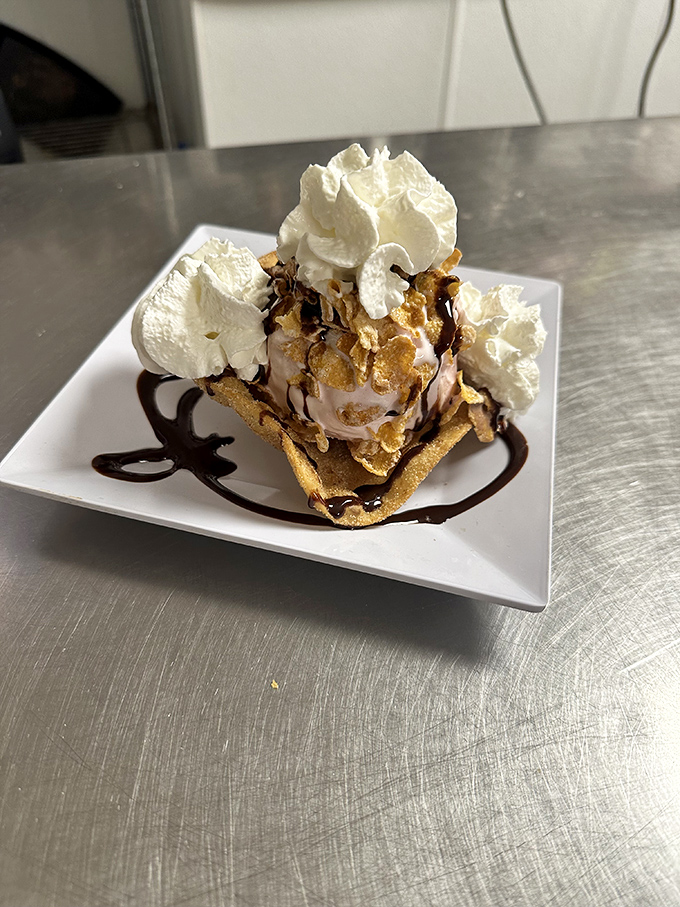 Dessert that makes you question why you ever wasted time on ordinary sundaes&mdash;crispy shell, ice cream, whipped cream, and caramel in blissful union.