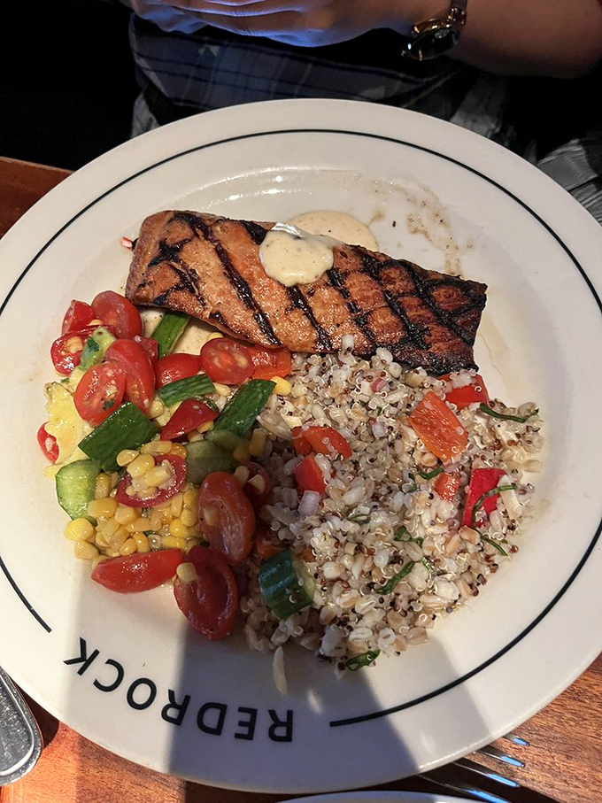 Grilled salmon that makes you forget you're in a landlocked state. Paired with fresh vegetables that prove Oklahoma knows its way around produce too.