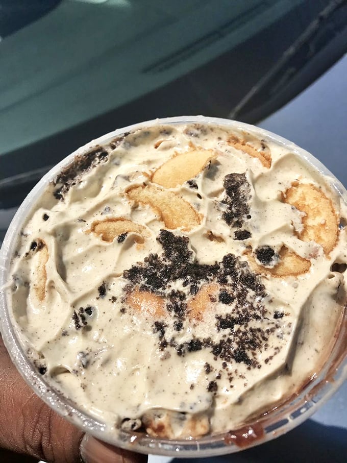 Cookies, chocolate, bananas, and cream collide in a cup of pure joy that makes you forget you're eating it with a plastic spoon.