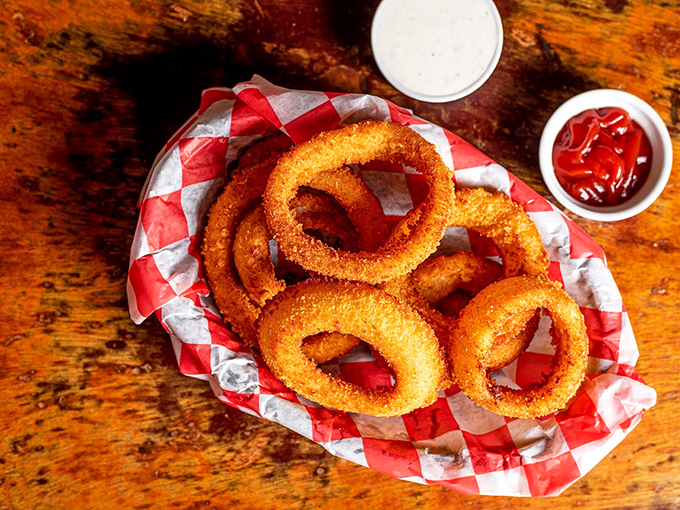 Golden halos of crispy perfection. These onion rings aren't just sides&mdash;they're the main event masquerading as supporting characters.