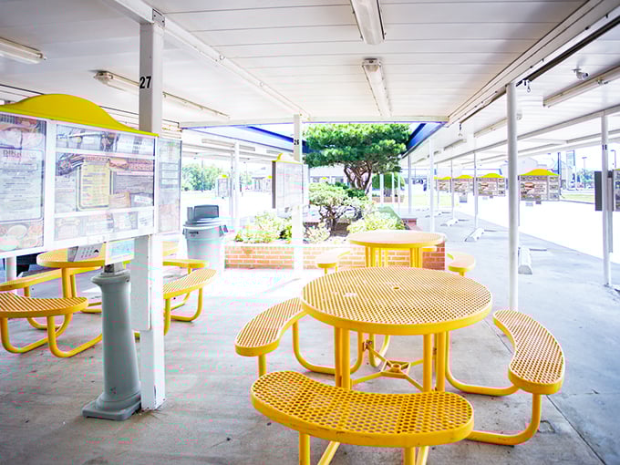 Those yellow tables have heard decades of first dates, family celebrations, and the satisfied silence that follows the first bite of greatness.