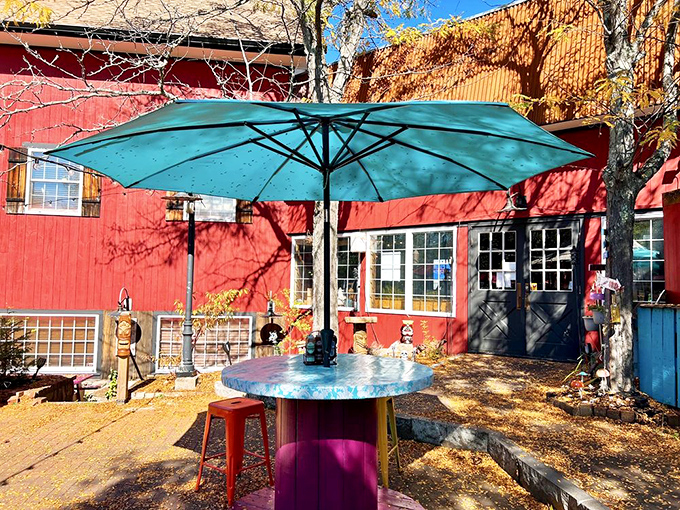 The outdoor seating area&mdash;where fresh air meets fresh barbecue. A turquoise umbrella never looked so inviting.