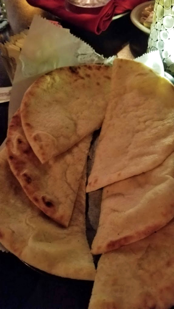 Warm pita bread&mdash;the unsung hero of the Jamil's experience, ready to scoop up Lebanese appetizers before the steaks arrive.