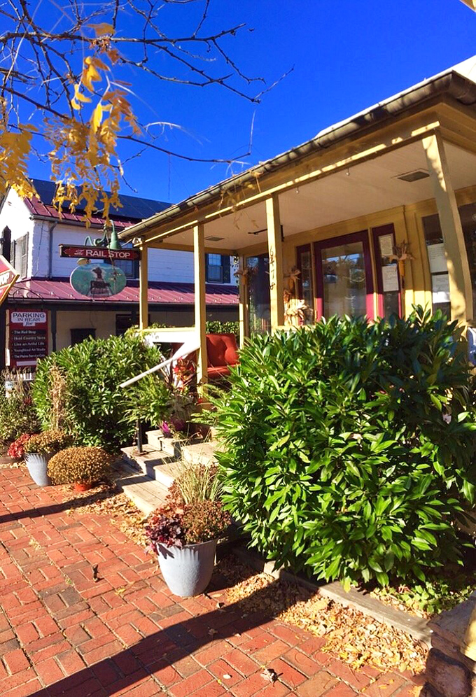 Sunshine bathes the welcoming porch in golden light, while brick pathways lead hungry visitors to culinary contentment.