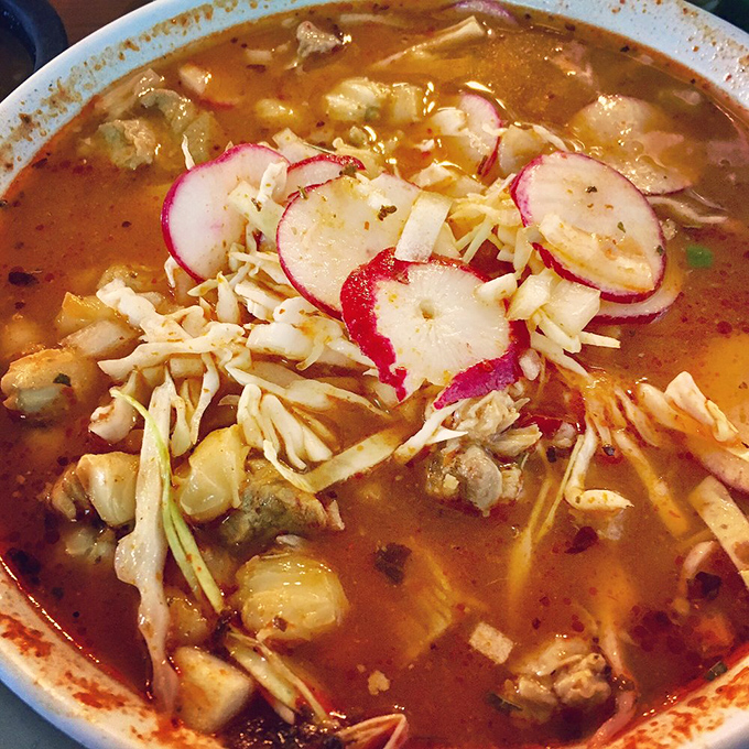 Street tacos done right: simple corn tortillas, well-seasoned meat, fresh cilantro, diced onion, and lime wedges standing by for duty.