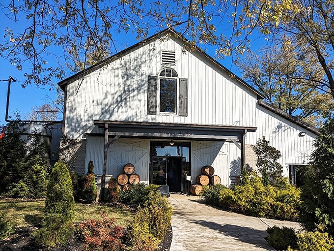 This white barn distillery isn't playing dress-up&mdash;it's the real Kentucky deal, where bourbon barrels out front telegraph the treasures aging within.