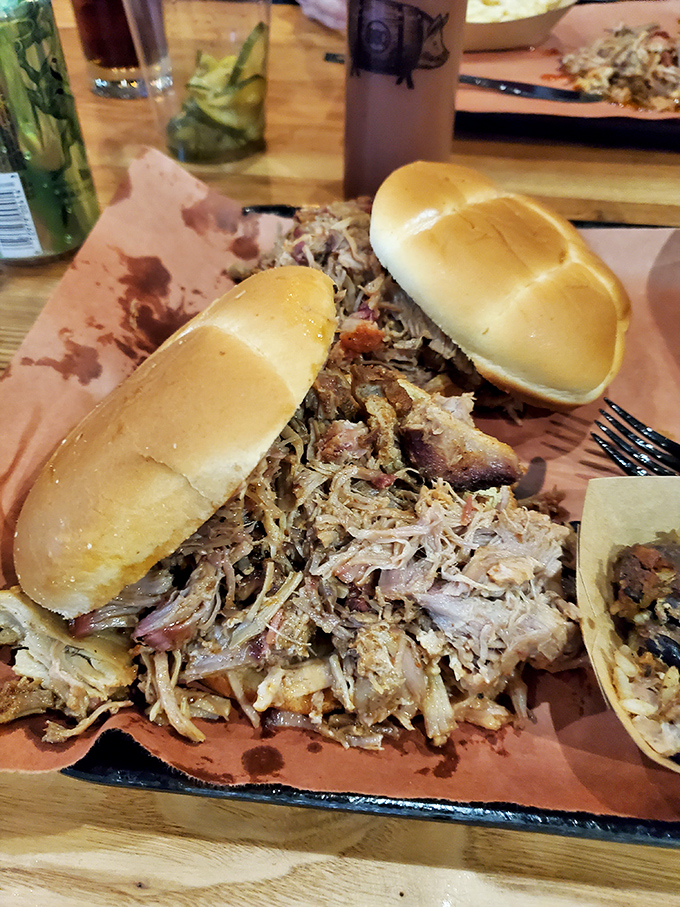 Pulled pork sandwiches that require both hands and several napkins. The meat-to-bun ratio here favors the carnivore in the most beautiful way.