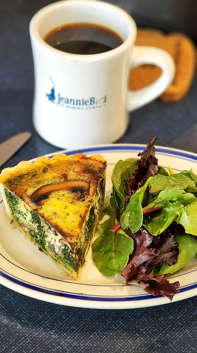 A slice of quiche that's living its best life&mdash;fluffy, herb-flecked, and paired with greens to make you feel virtuous while indulging.