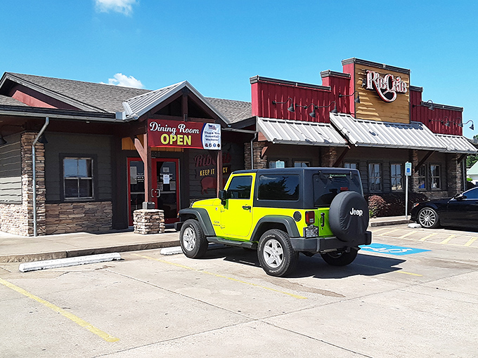 Rib Crib's bright yellow Jeep parked outside is like a beacon calling to BBQ lovers—"Follow me to the promised land of sauce and smoke!"