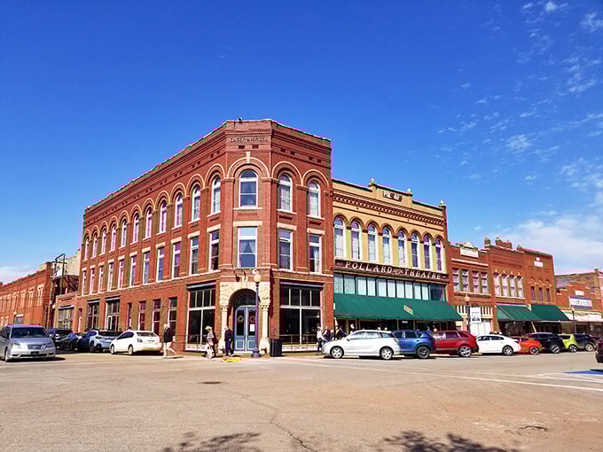 Historic buildings frame both sides of downtown Guthrie, creating a canyon of architectural splendor that makes every stroll feel like walking through a living museum.