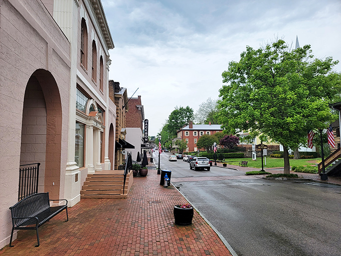 Brick sidewalks and historic storefronts create a streetscape that feels both frozen in time and vibrantly alive.