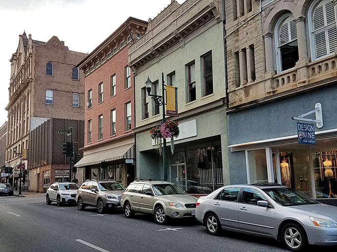 Downtown storefronts invite exploration with their colorful awnings and hanging flower baskets &ndash; retail therapy with architectural eye candy included.
