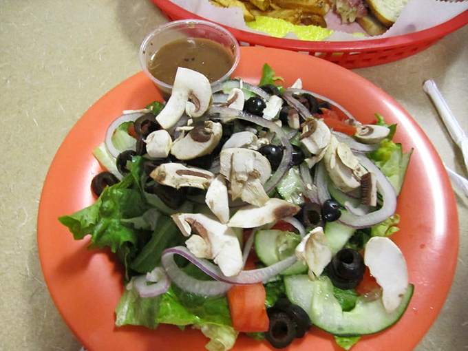 Not just a side salad but a supporting actor deserving its own award&mdash;fresh veggies, olives, and mushrooms playing their parts perfectly.