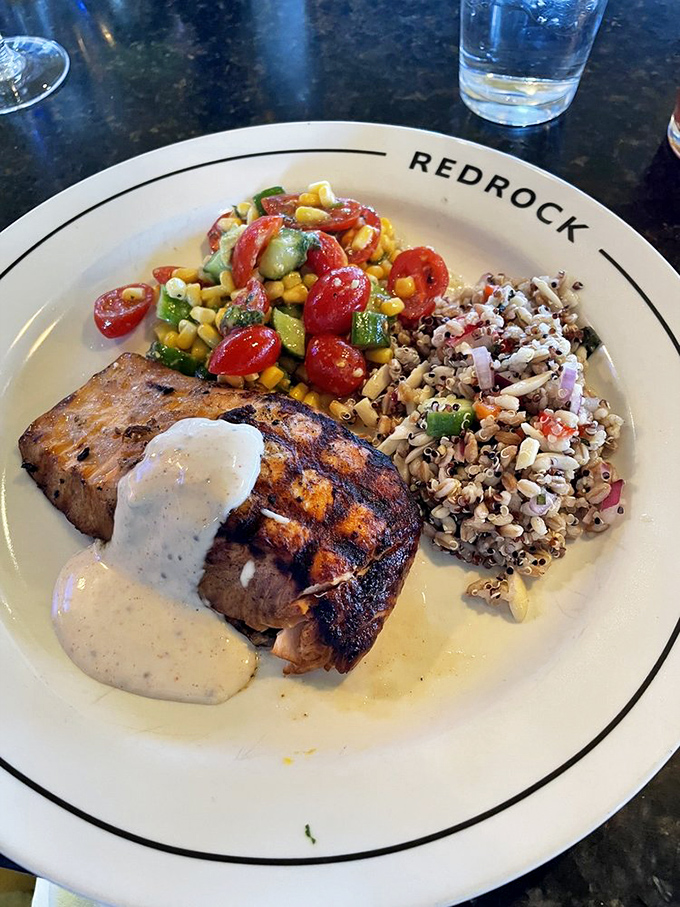 Perfectly grilled salmon meets summer on a plate&mdash;a symphony of fresh corn salad and hearty grains that somehow feels both indulgent and virtuous.