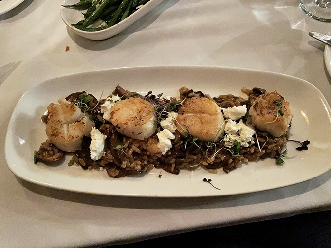 These seared scallops perched atop savory risotto aren't just appetizers&mdash;they're the opening act for the beef headliner.