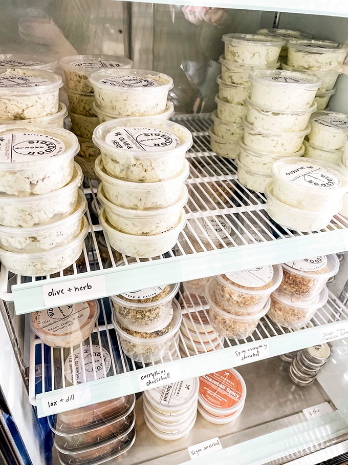 The schmear case&mdash;a dairy dreamscape of possibilities. From classic plain to adventurous herb blends, each container holds spreadable joy.