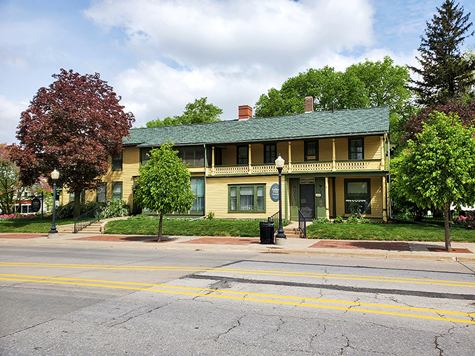 The Scholte House Museum stands as a yellow sentinel of history, where America and the Netherlands shook hands and decided to make something beautiful together.