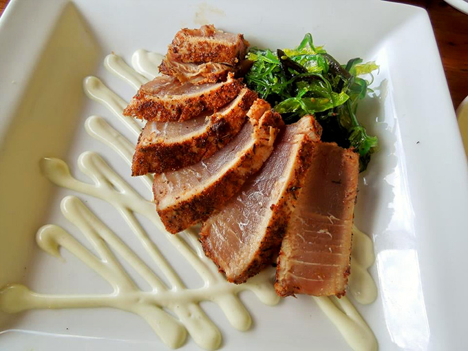 Seared tuna slices fanned out like a deck of delicious cards, with wasabi standing by for those brave enough to clear their sinuses.