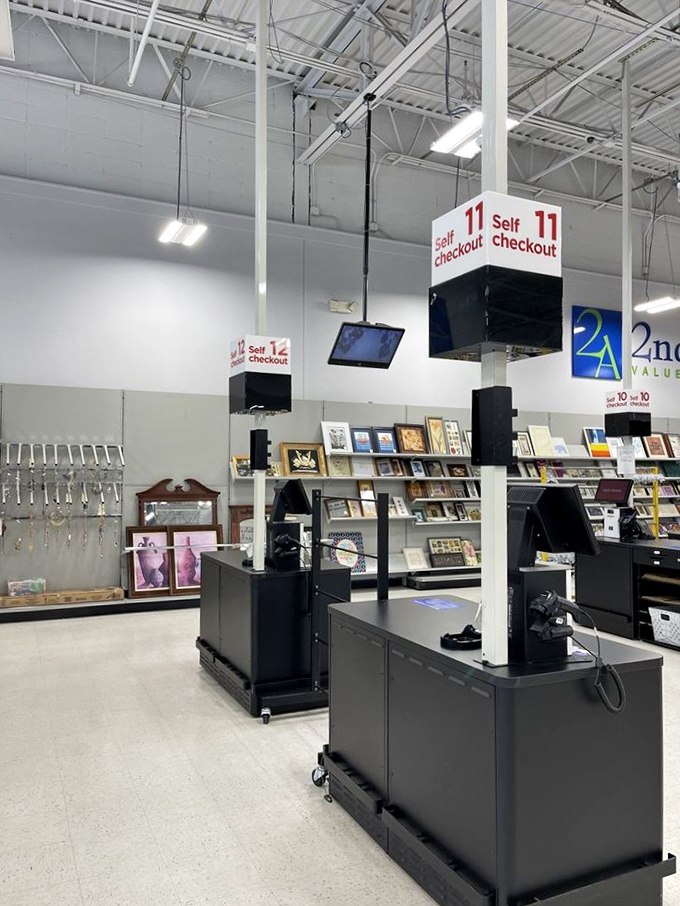Self-checkout counters stand ready for your thrifting triumph. The final stage of your treasure hunt journey, where victory costs a fraction of retail.