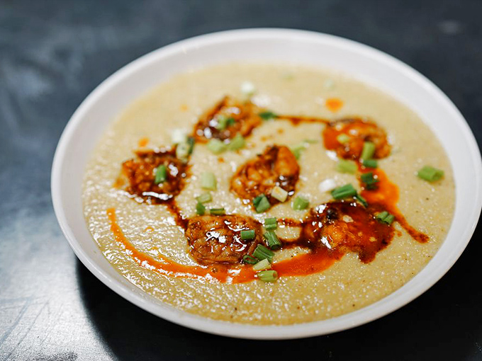 This isn't just shrimp and grits—it's a Southern hug in bowl form, with a spicy sauce drizzle that's doing a victory lap around the perimeter.