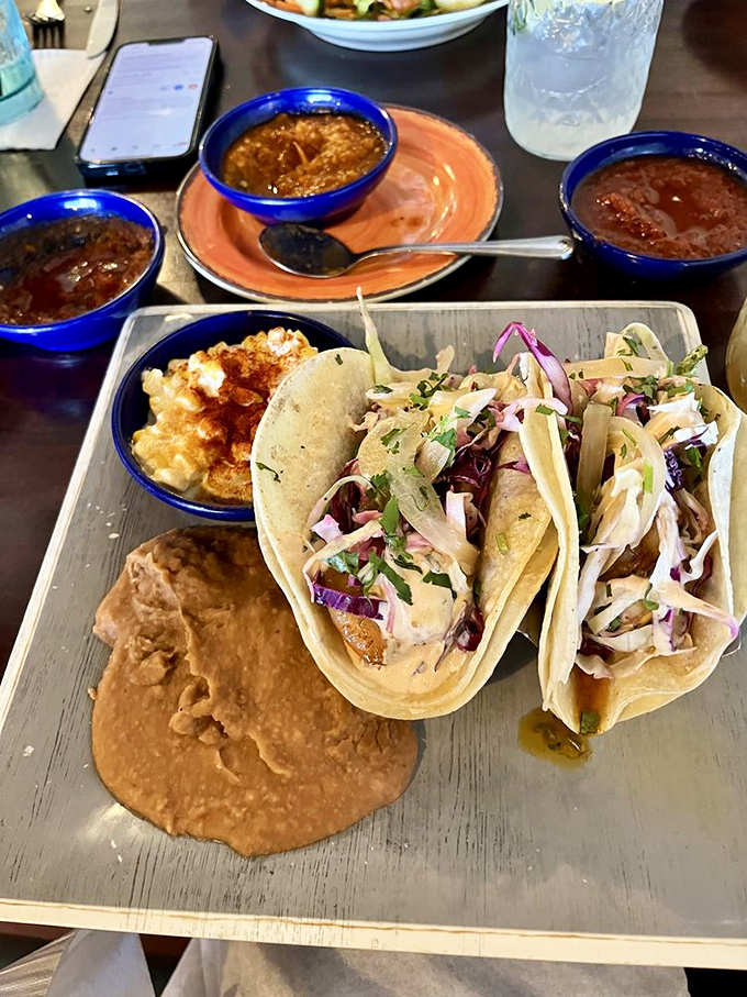 These tacos aren't just assembled – they're composed, with each element playing its role in a symphony of textures and flavors.