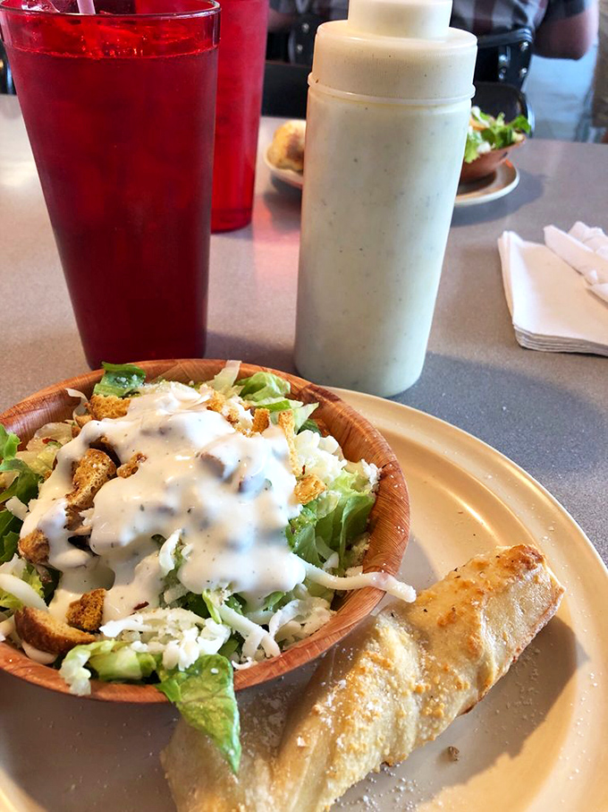 A side salad and garlic bread that proves Iriana's understands the importance of a proper opening act before the pizza headliner takes the stage.