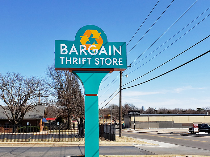 The teal sign stands as a beacon to bargain hunters. That recycling symbol promises sustainability along with savings.