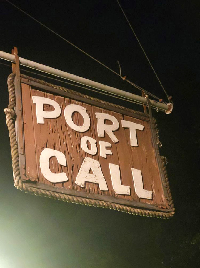 The iconic sign glows like a beacon in the night, guiding hungry souls to the promised land of perfect burgers.