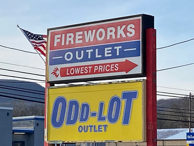 The roadside siren call of "FIREWORKS OUTLET" above Odd-Lot—because nothing complements bargain-hunting like explosives.