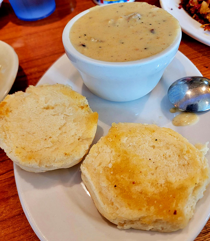 French toast that's dressed for success. Powdered sugar snowfall meets butter glacier on a plate of morning perfection.