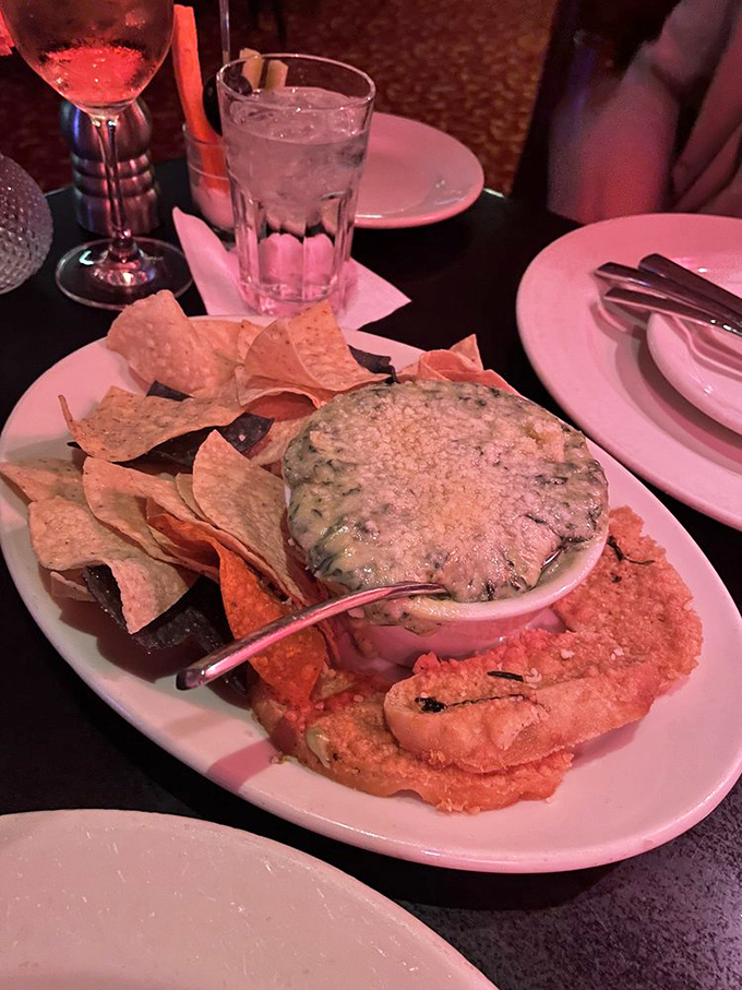 The spinach-artichoke dip arrives with a golden crust that makes a satisfying crack when your chip breaks through&mdash;culinary ASMR at its finest.