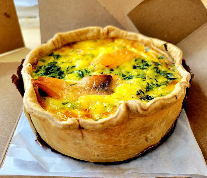 This spinach salmon quiche has walls so perfectly flaky they could teach architecture students a thing or two about structural integrity.