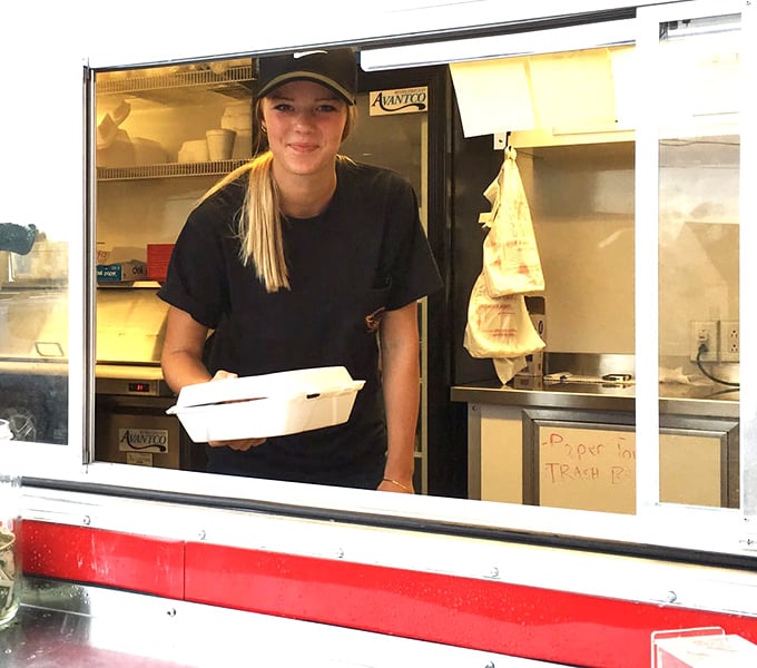 The universal language of takeout happiness, translated through a window where barbecue dreams are packaged to temporarily leave the premises.