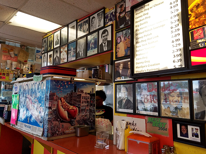 Behind every great hot dog stand is a wall of memories and a counter of dreams. The photos watching over this operation are silent witnesses to decades of deliciousness.