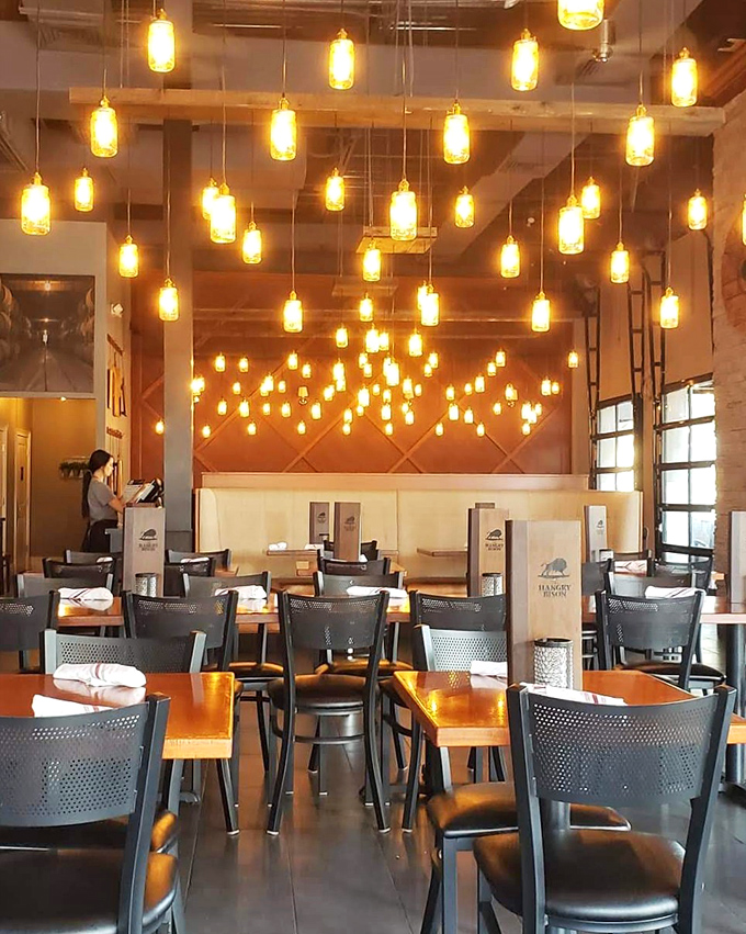 Mason jar pendant lights create a warm glow throughout the dining room, inviting you to linger long after your plate is clean.