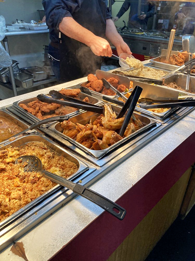 The buffet line heroes, ensuring fresh food makes its way from kitchen to hungry patrons with military precision.