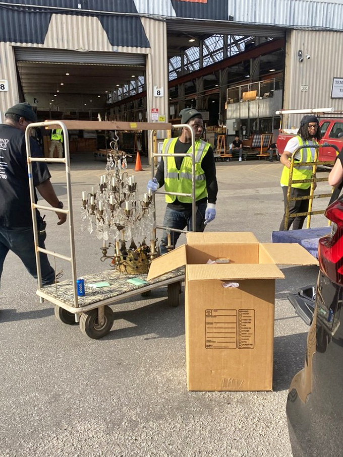 The real treasure of Second Chance: dedicated staff carefully transporting yesterday's chandeliers to tomorrow's dining rooms, creating jobs while preserving history.