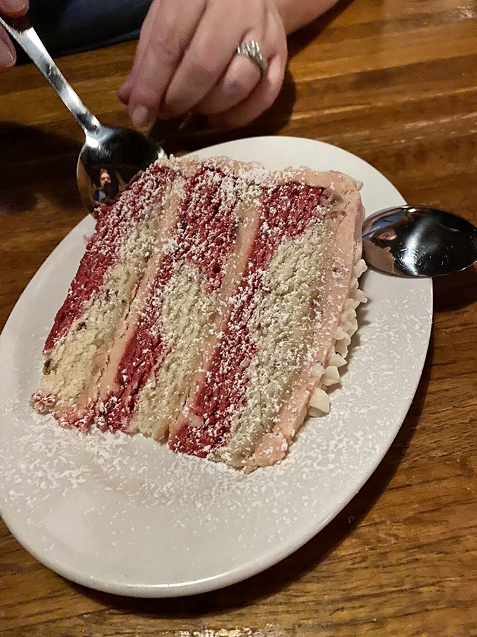 This isn't just cake; it's a stratified celebration of strawberry and cream that makes birthday candles entirely unnecessary.