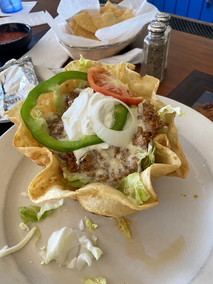 Taco salad: Where healthy meets happy in a crispy shell. It's like a fiesta in an edible bowl!