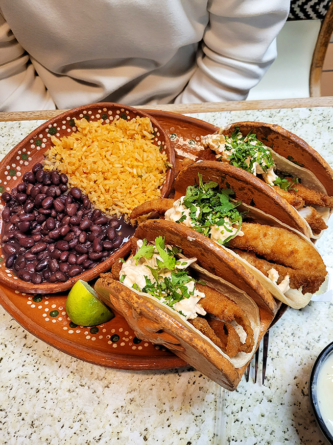 These fish tacos, garnished with a sprinkle of cilantro and a lime wedge, deliver the kind of flavor that inspires spontaneous happy dances.
