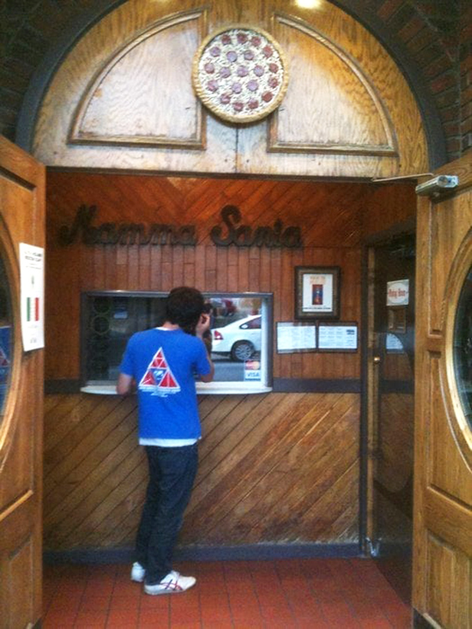 The takeout counter where pizza dreams come true. That little window has launched thousands of perfect nights in.
