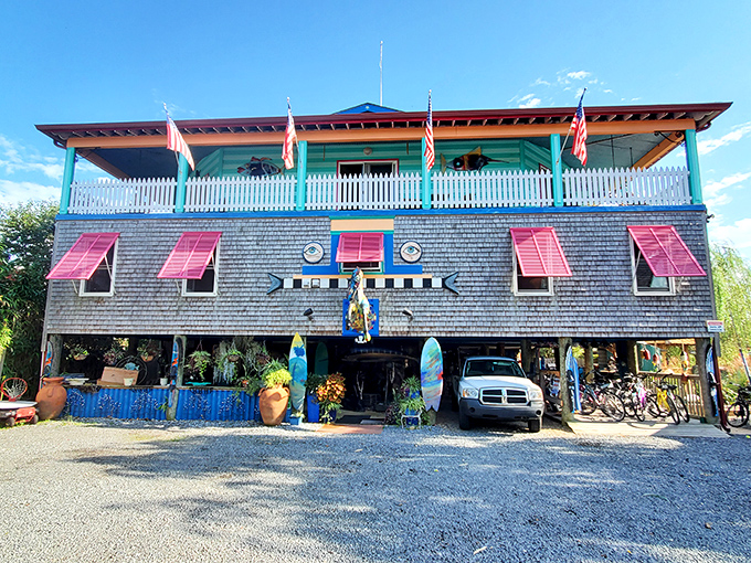The Blue Water House bursts with coastal character, its weathered shingles and vibrant accents creating the quintessential beach town bed and breakfast experience.