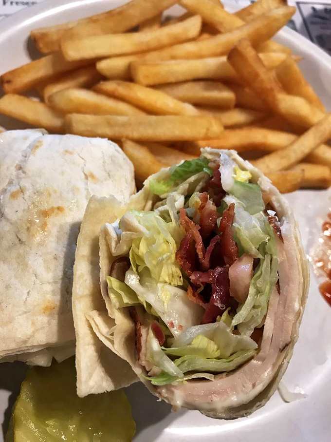 The wrap&mdash;civilization's greatest contribution to portable eating. This one's stuffed with enough fillings to require both hands and several napkins.