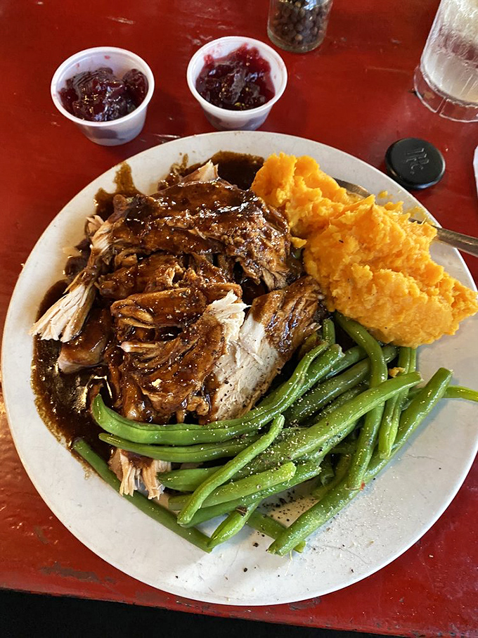 Thanksgiving comes to the tropics with this turkey dinner that proves comfort food knows no season, especially when served with sweet potatoes bright as a Key West sunset.